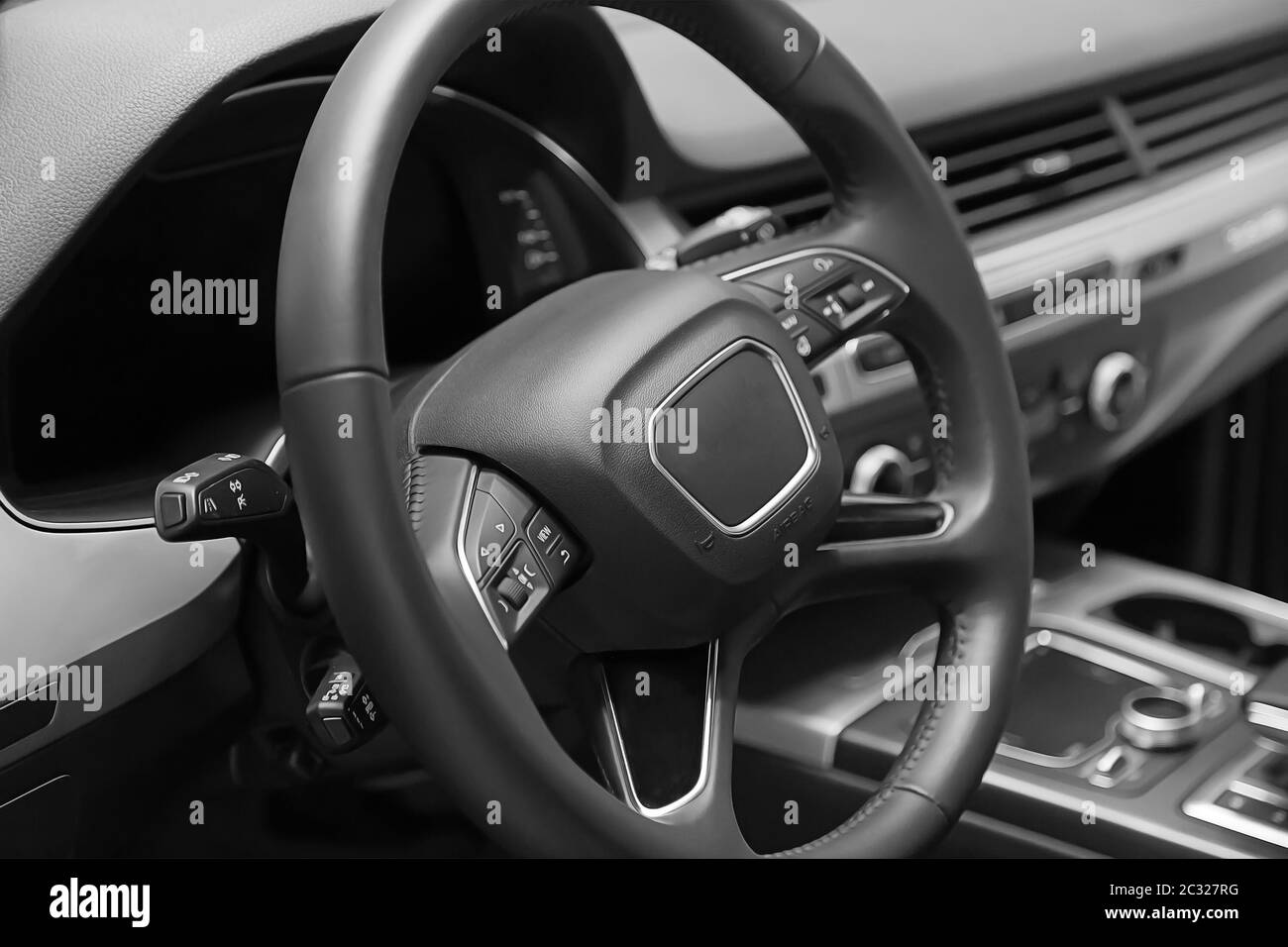 Leather multifunction steering wheel in the cabin of a premium car ...