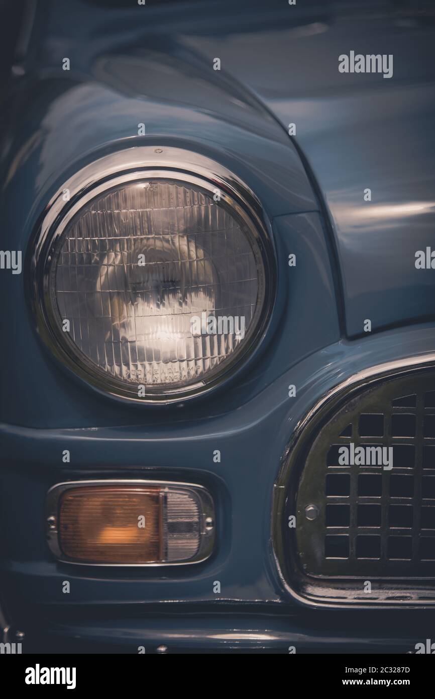 Close up vertical image of the headlight of a vintage classic car Stock ...