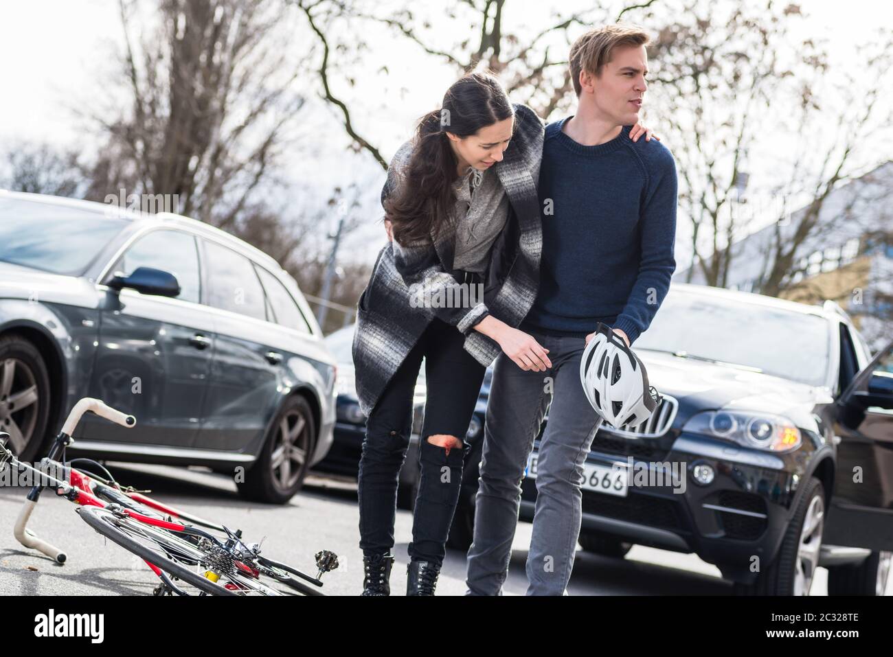 Helping the injured hi-res stock photography and images - Alamy