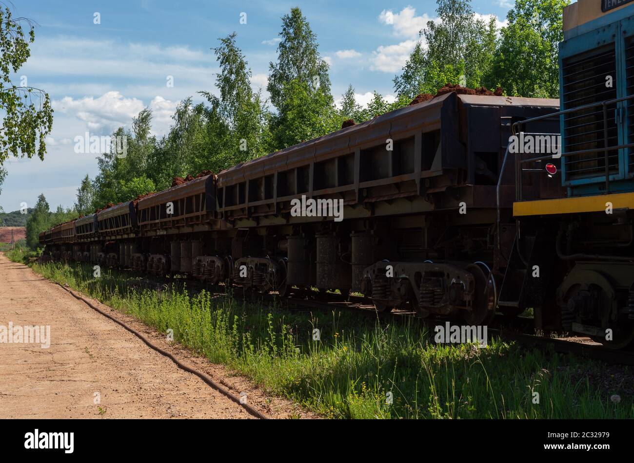 The train loaded with clay leaving opencast mining site Stock Photo - Alamy