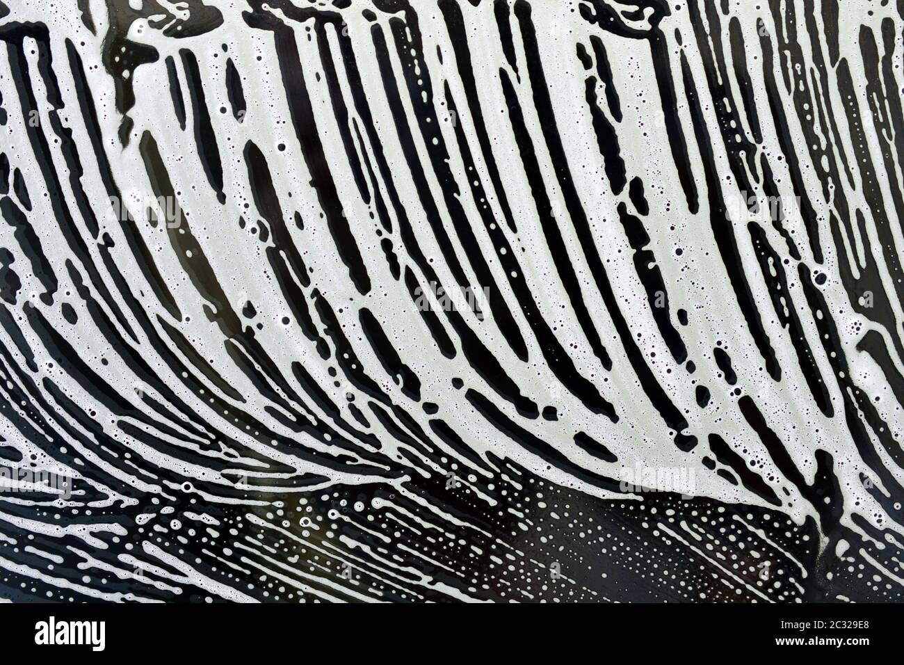 car wash foam patterns on a car window,image of a Stock Photo - Alamy