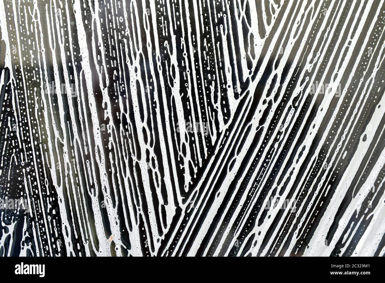 car wash foam patterns on a car window,image of a Stock Photo - Alamy