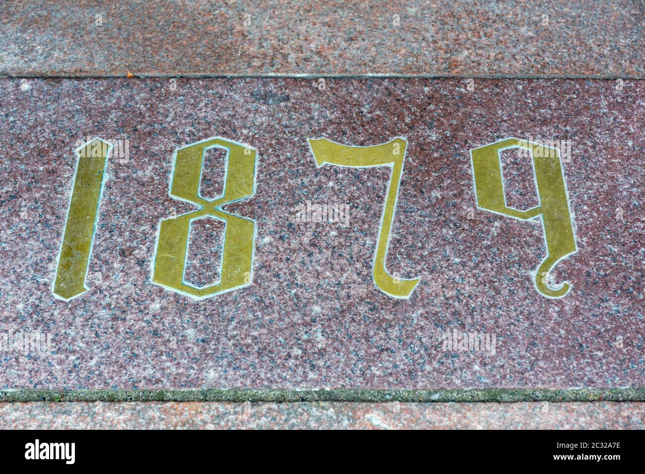 Brass Numbers Year 1879 at Granite Stone Stock Photo - Alamy