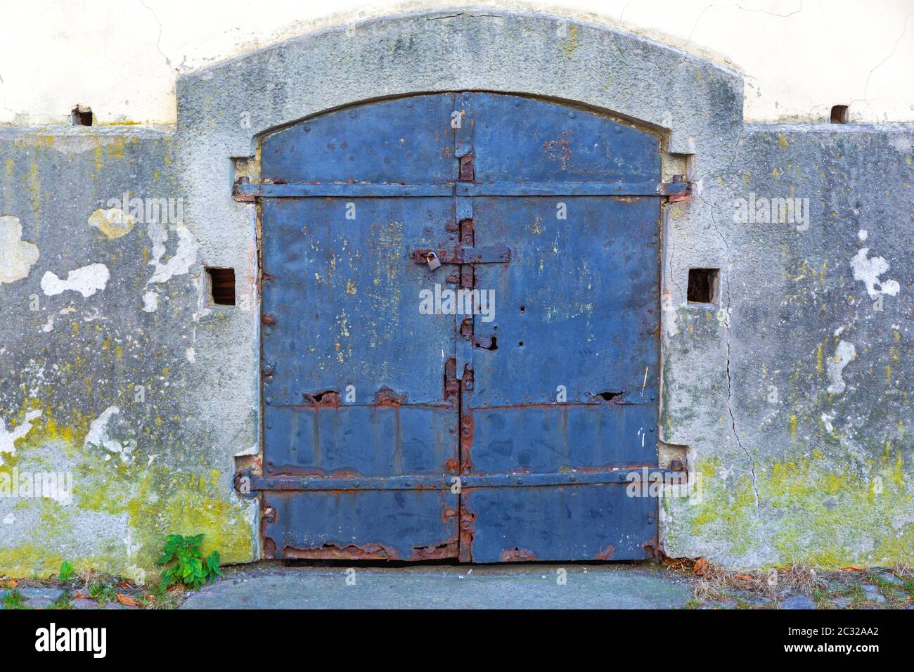 Rust Damage at Old Double Door for Cellar Stock Photo - Alamy