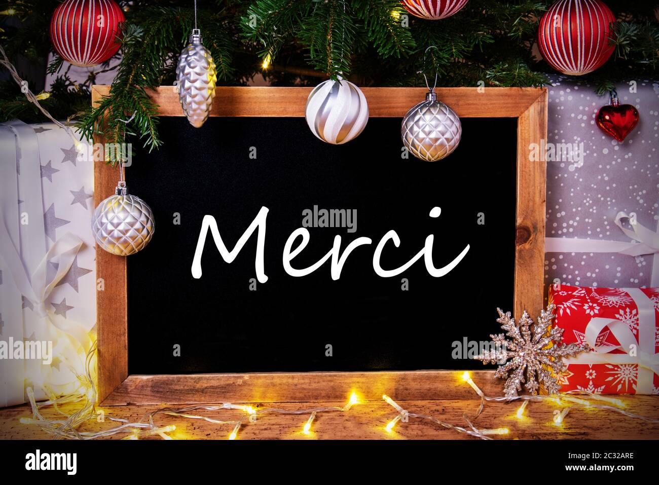 Blackboard With French Text Merci Means Thank You. Christmas Tree With ...