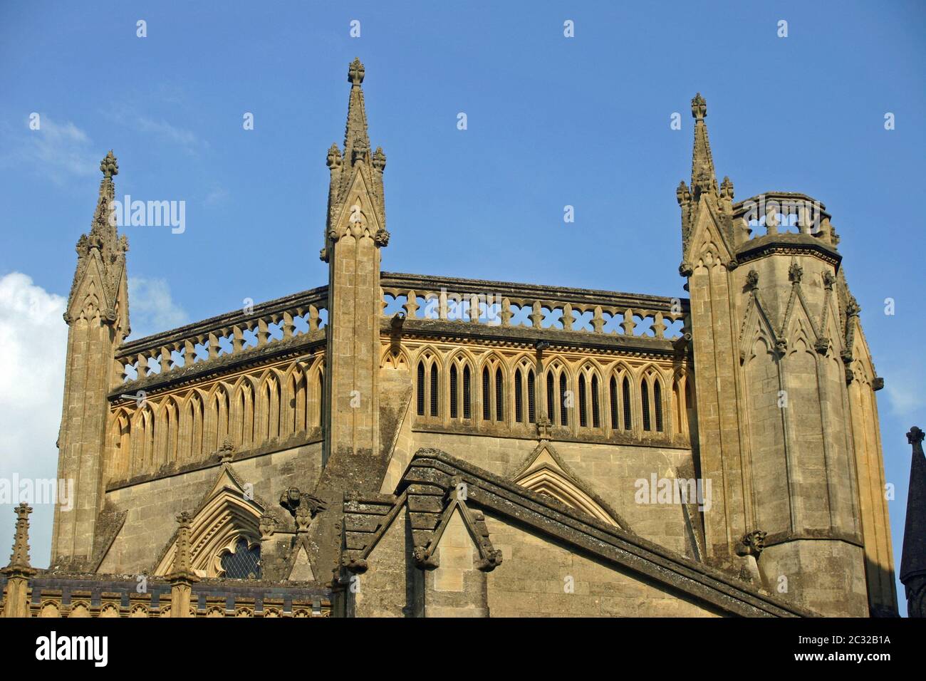The upper part of a tower of Wells Cathedral, Somerset. Background of ...