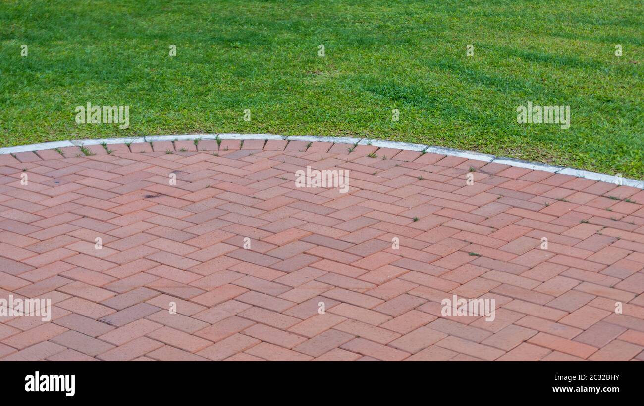Pavement and Grass Curved Divider Line in Park Stock Photo - Alamy