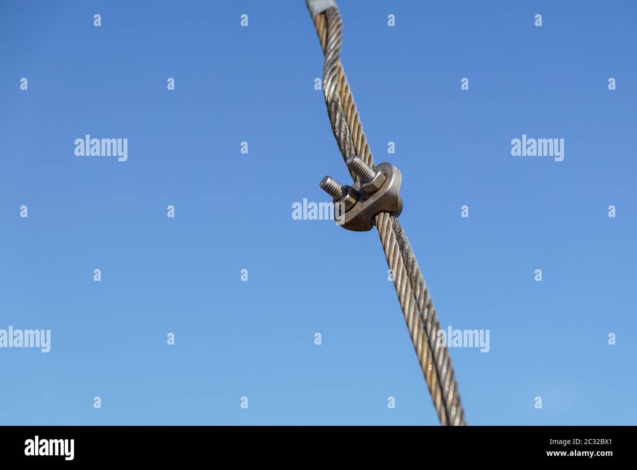 Cable steel wire and metal clamp a part of bridge structure Stock Photo ...