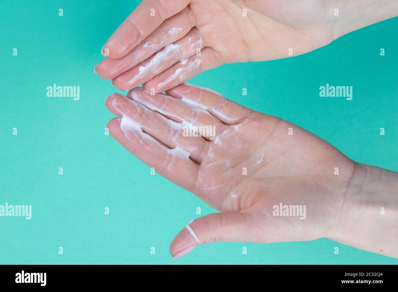 Women's hands rub disinfectant gel in hand. Top views Stock Photo - Alamy