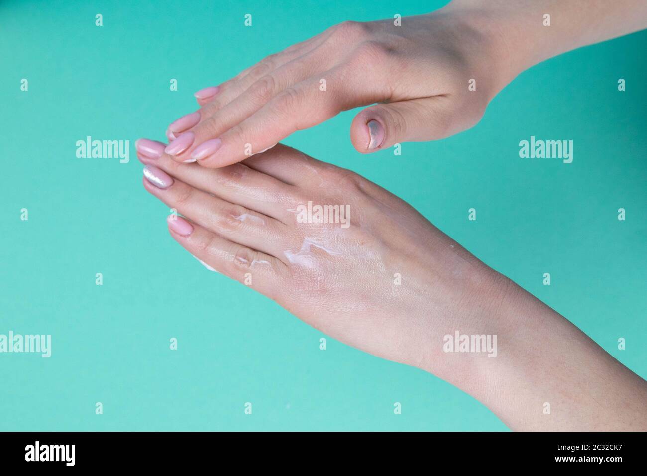 Women's hands rub disinfectant gel in hand. Top views Stock Photo - Alamy