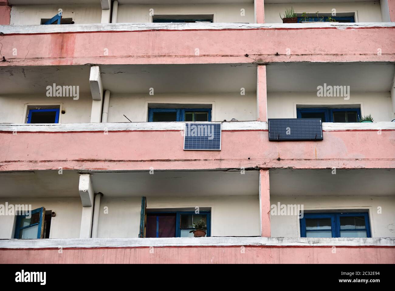 A typical facade of the apartment building in Pyongyang suburb. All ...