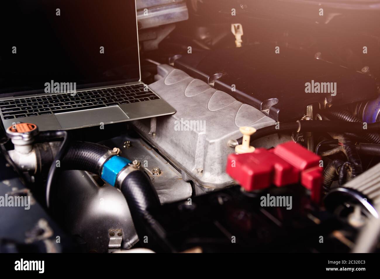 Laptop computer on car mechanic engine for service at workshop Stock ...