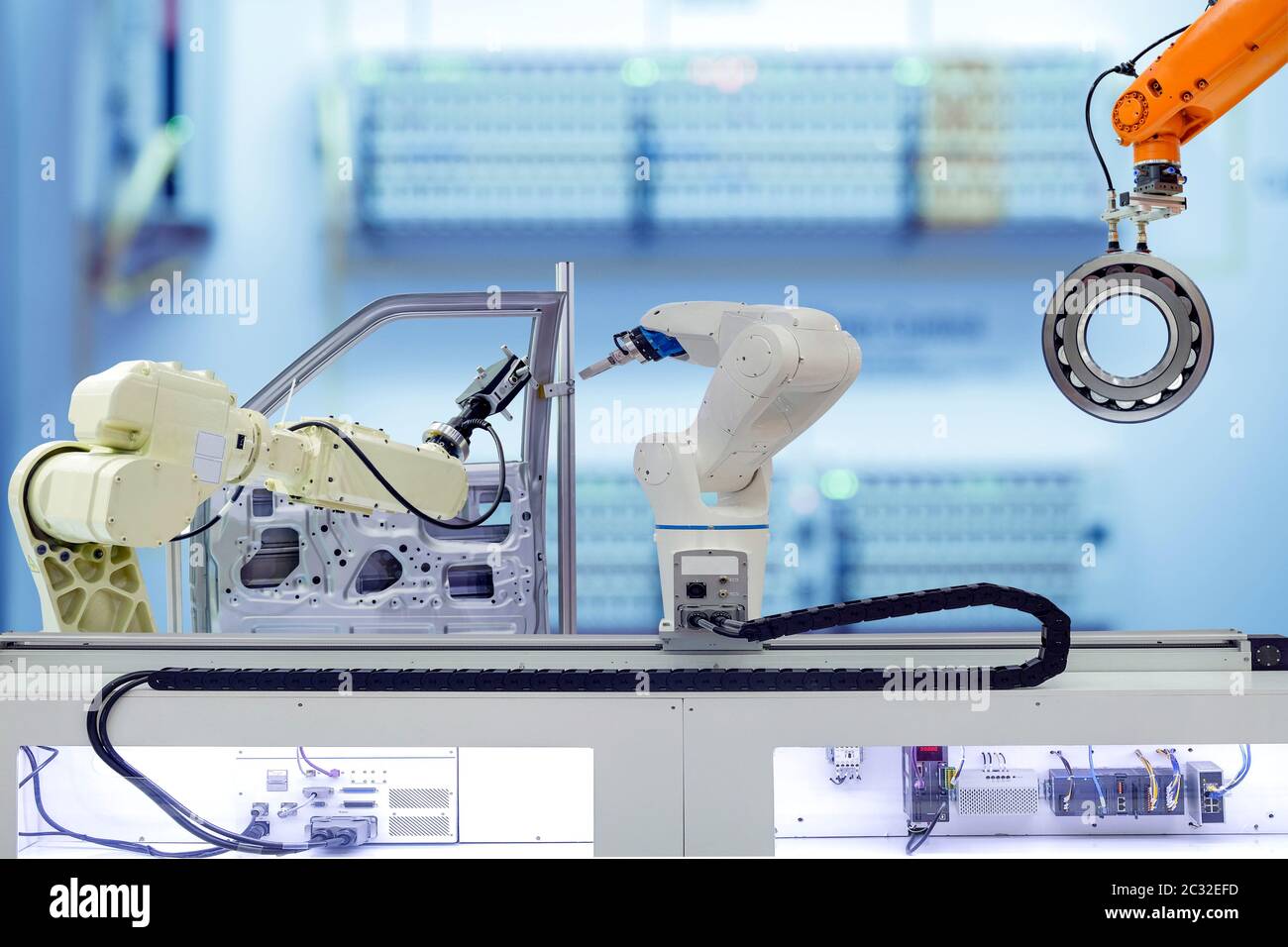 Industrial robotics working on automation with auto parts parts in ... Industrial robotics working on automation with auto parts parts in ...