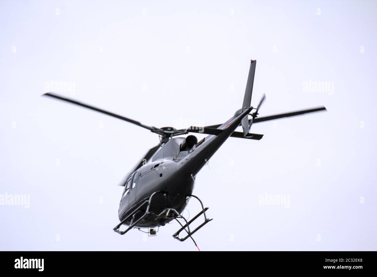 A cargo helicopter on the railway construction site KÃ¶then, mast ...