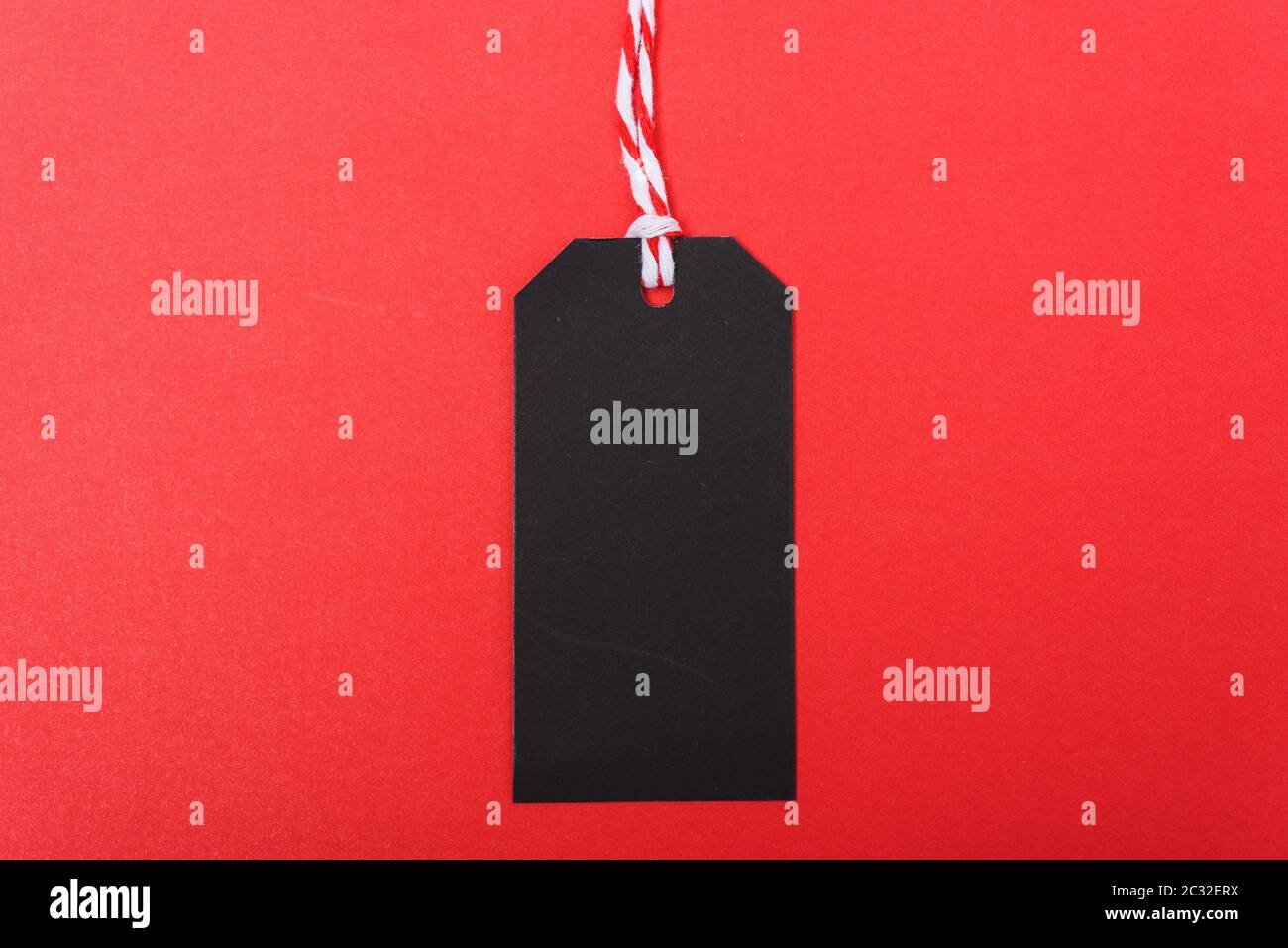 Red tag label on black background, blank copy space for you work ...