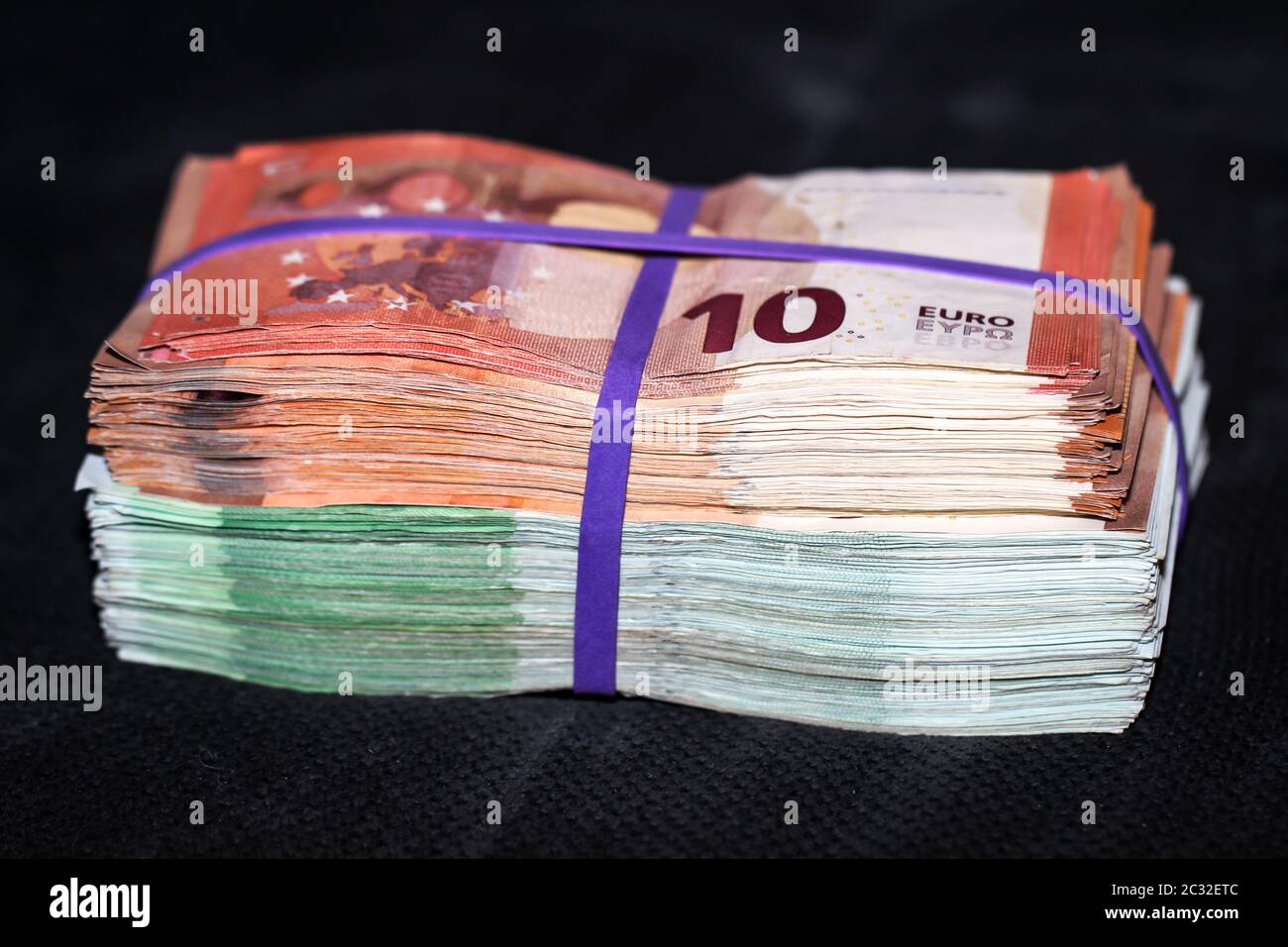several thousand euros in banknotes, banknotes bundled on a pile Stock ...