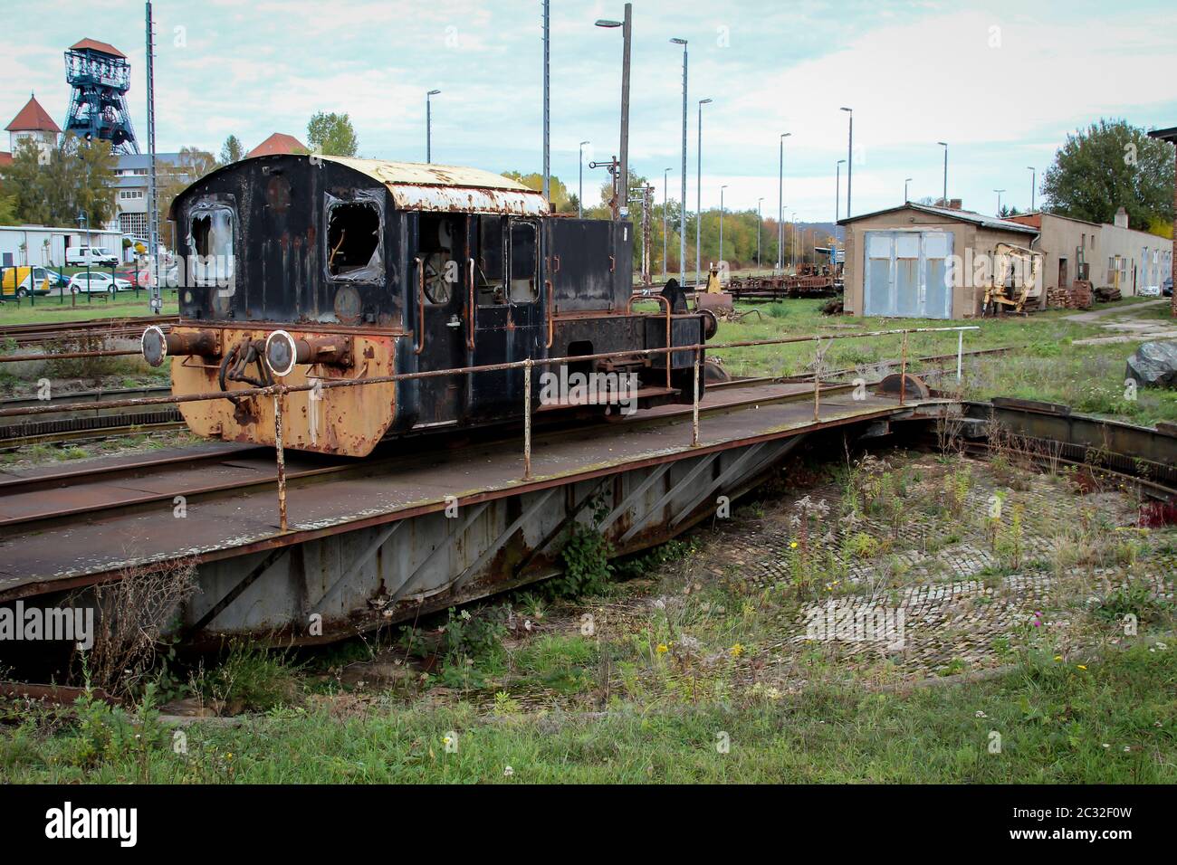 A burned shunting locomotive stands off the normal railroad tracks ...