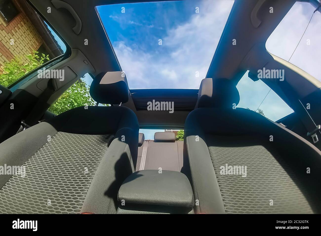 View of the sky from the open roof of the car Stock Photo - Alamy
