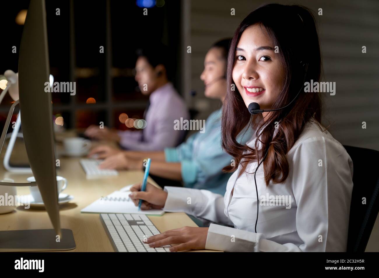 Call Center working at night Stock Photo - Alamy