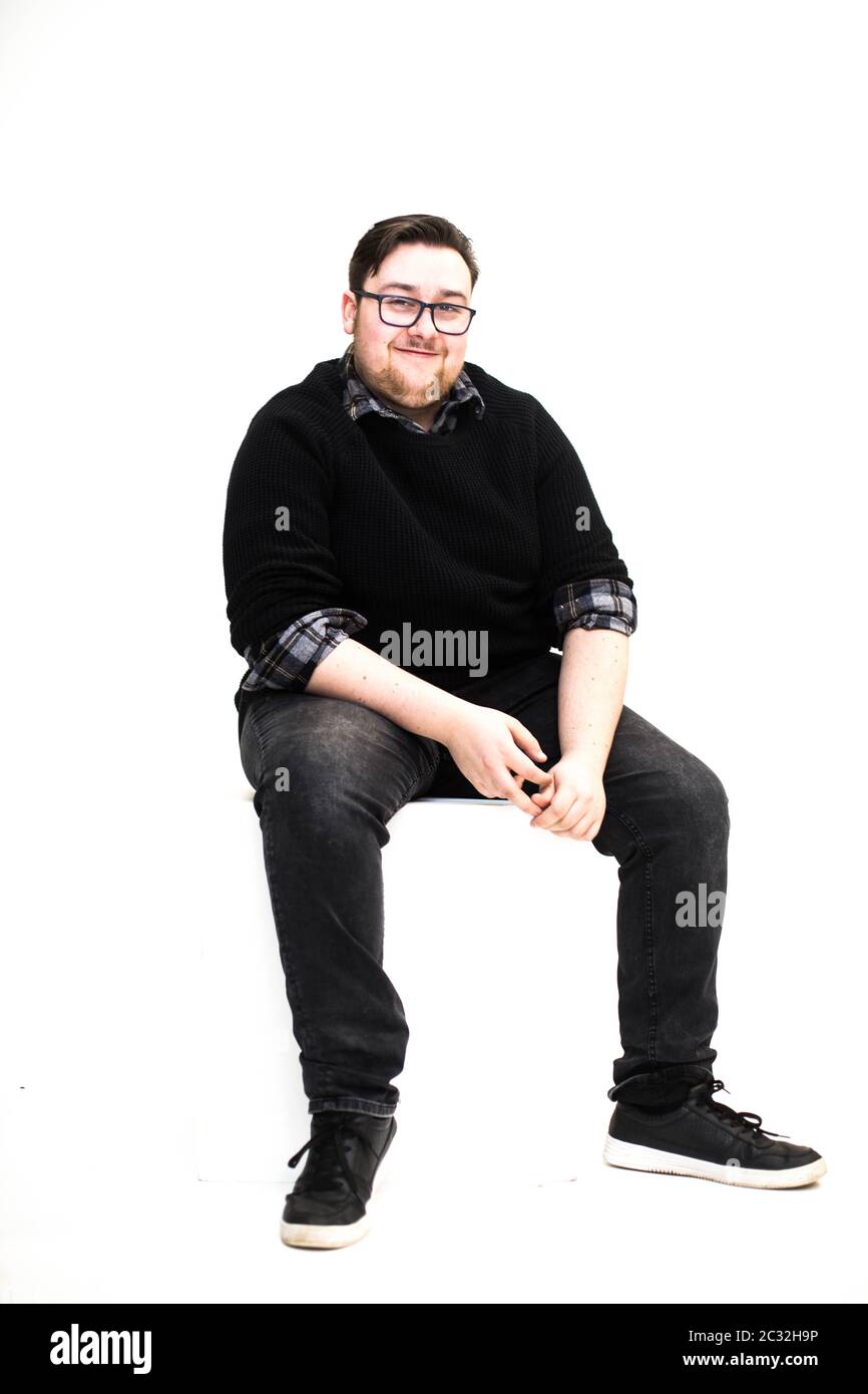 A young man posing on a white background Stock Photo - Alamy