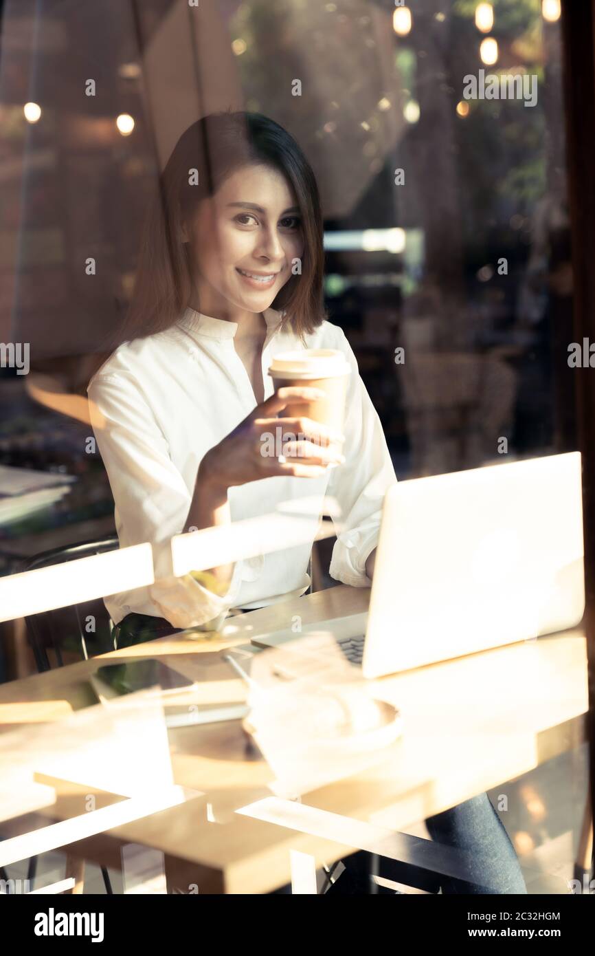 Freelancer woking at cafe Stock Photo - Alamy