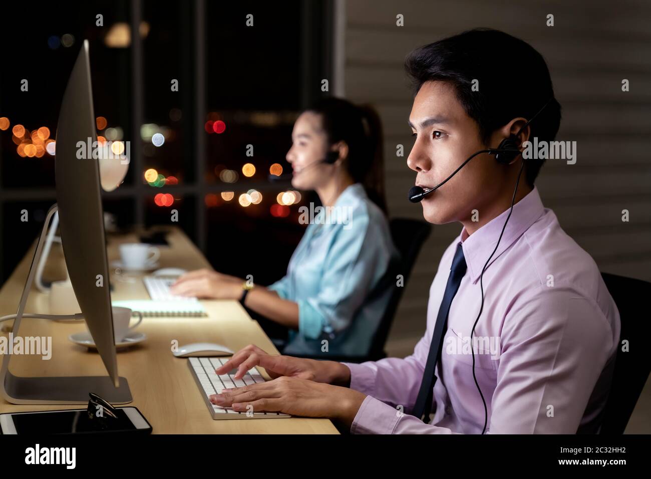 Call Center working hard at night Stock Photo - Alamy