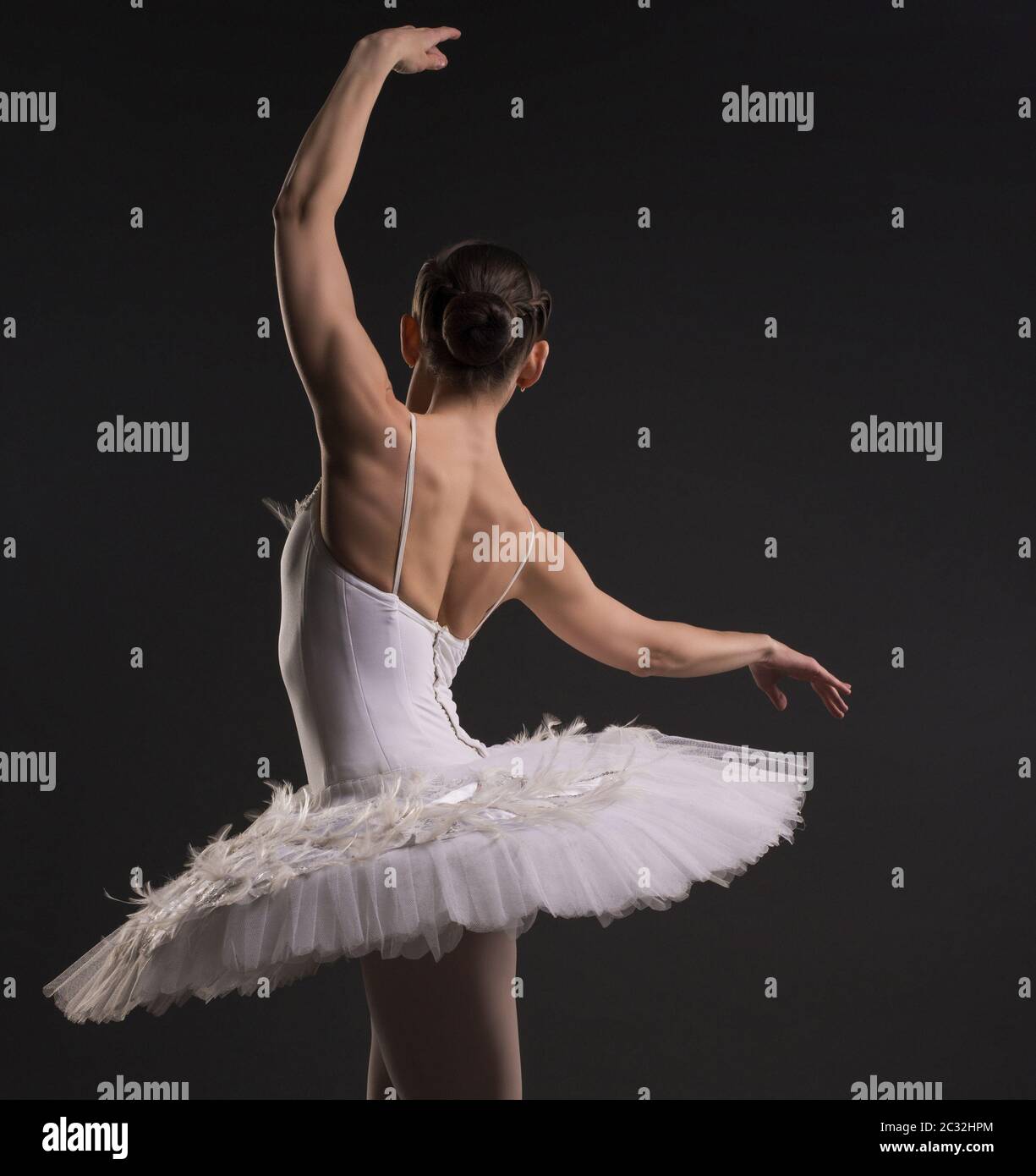 Beautiful ballerina dancing gracefully rearview Stock Photo - Alamy