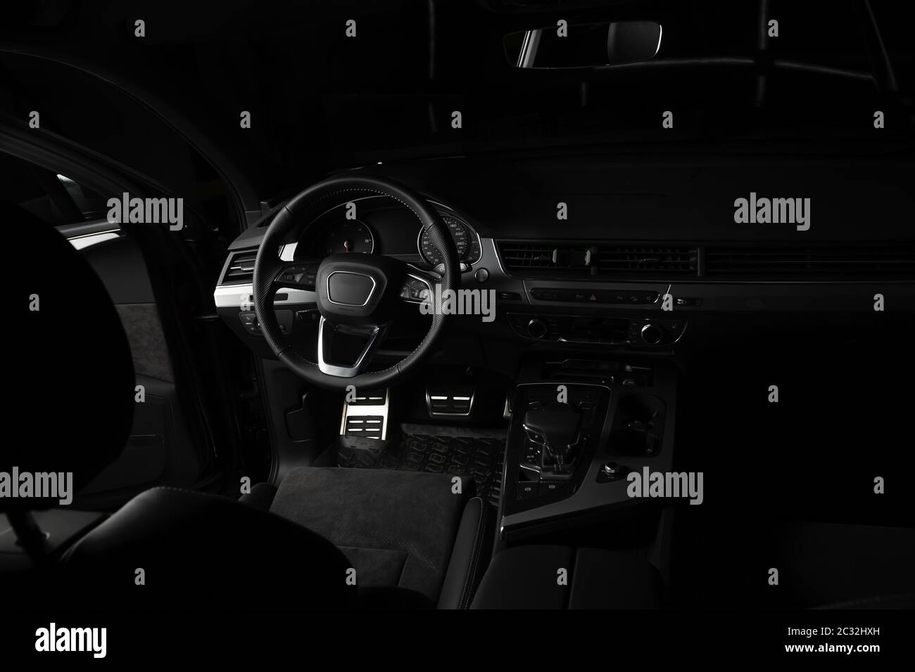 Interior of luxury suv car with black leather steering wheel and shift ...