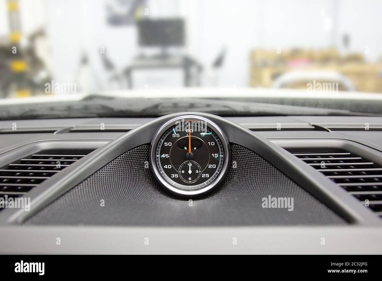 Chronometer with a clock in a luxury sports car. To measure lap times ...