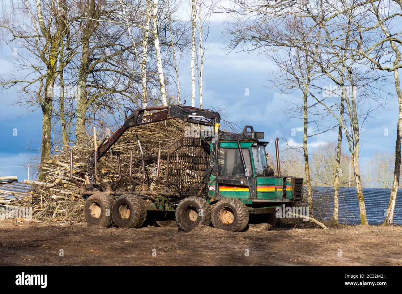 The wood loader after hard working day Stock Photo - Alamy