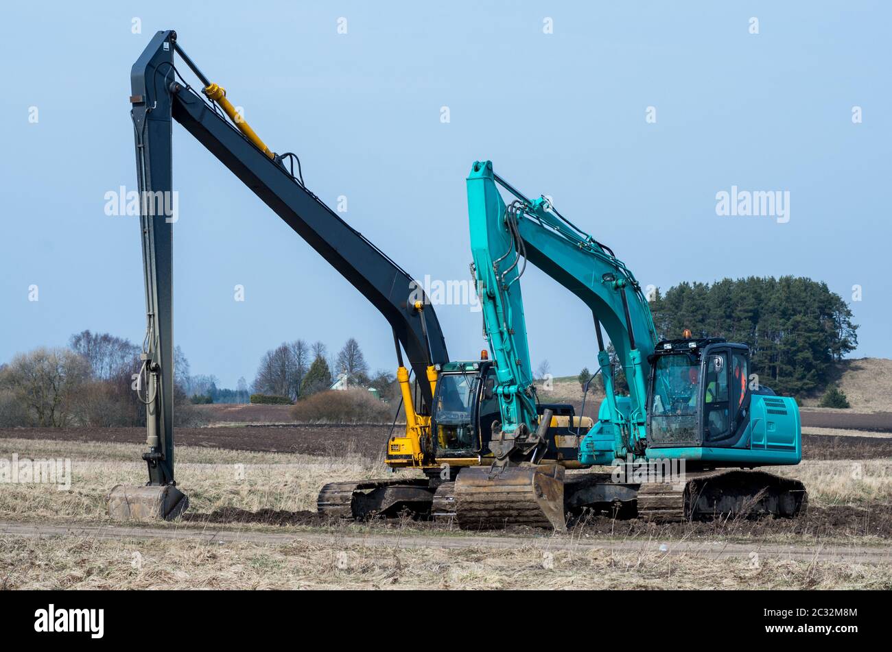 Two excavators hi-res stock photography and images - Alamy