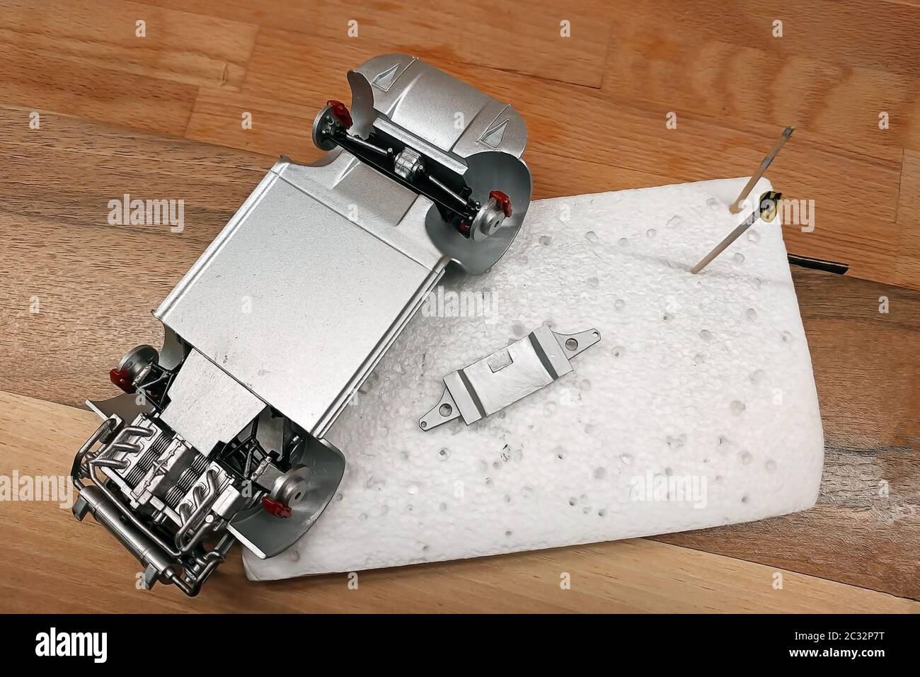 The process of assembling a scale car model. Glued and painted engine ...