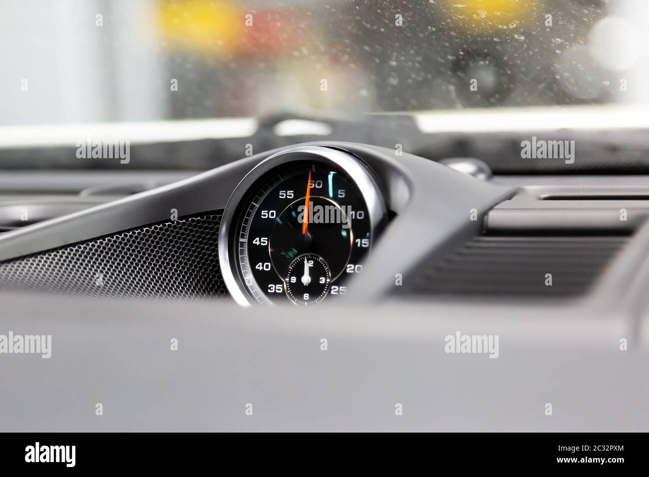 Chronometer with a clock in a luxury sports car. To measure lap times ...