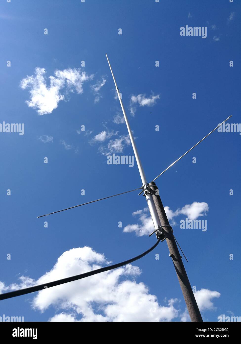 Monopole antenna on the roof in front of blue sky for ...