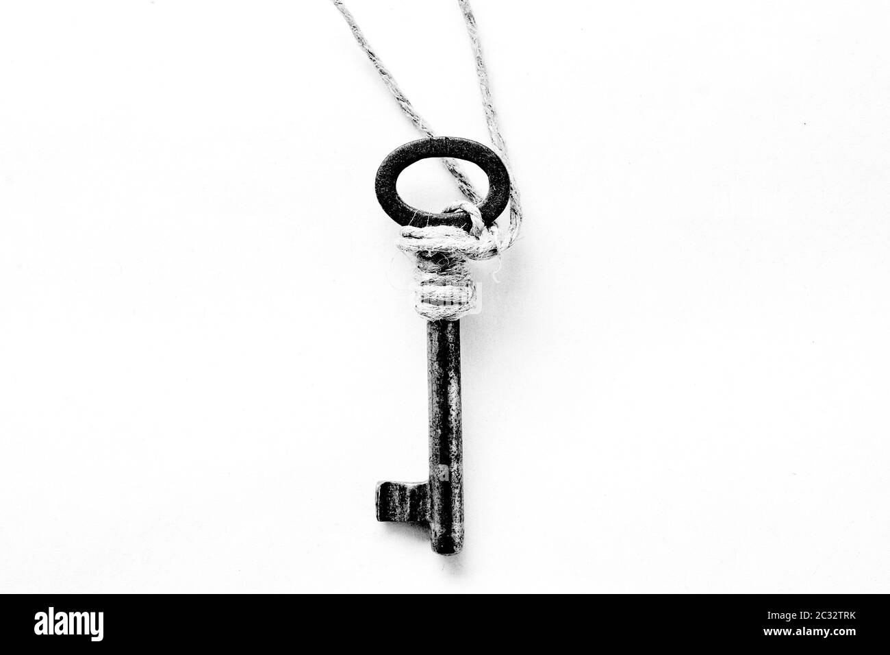 old rusty key on white background, image Stock Photo - Alamy