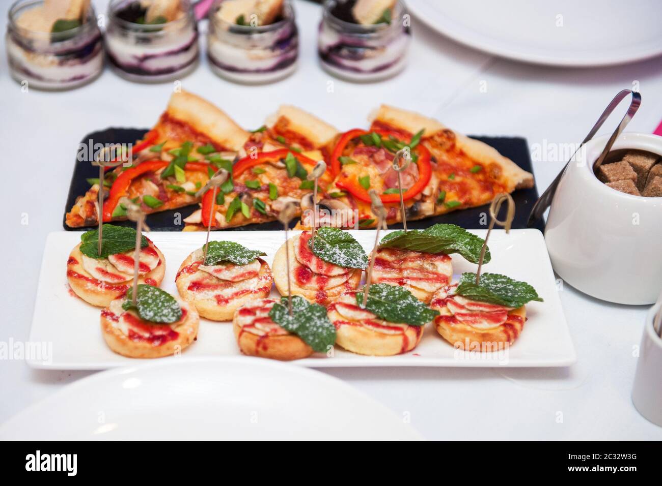 Catering food table set concept Stock Photo - Alamy