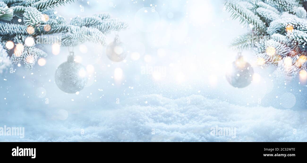 Christmas and advent concept. Silver balls on fir branches in front of ...
