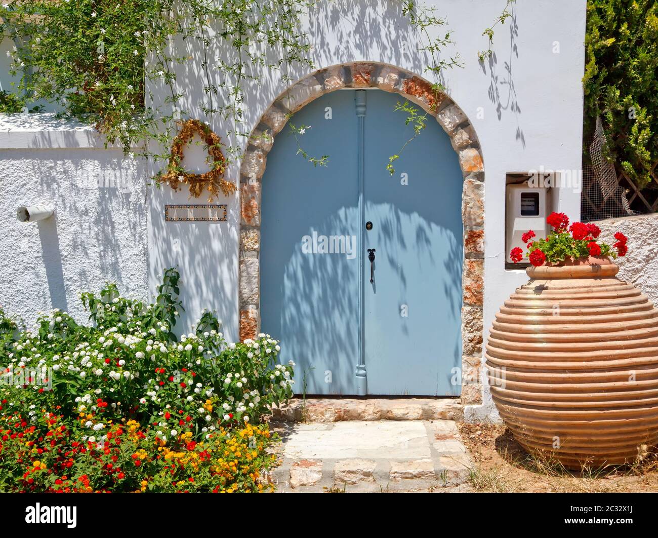 Entrance to greek house Stock Photo - Alamy