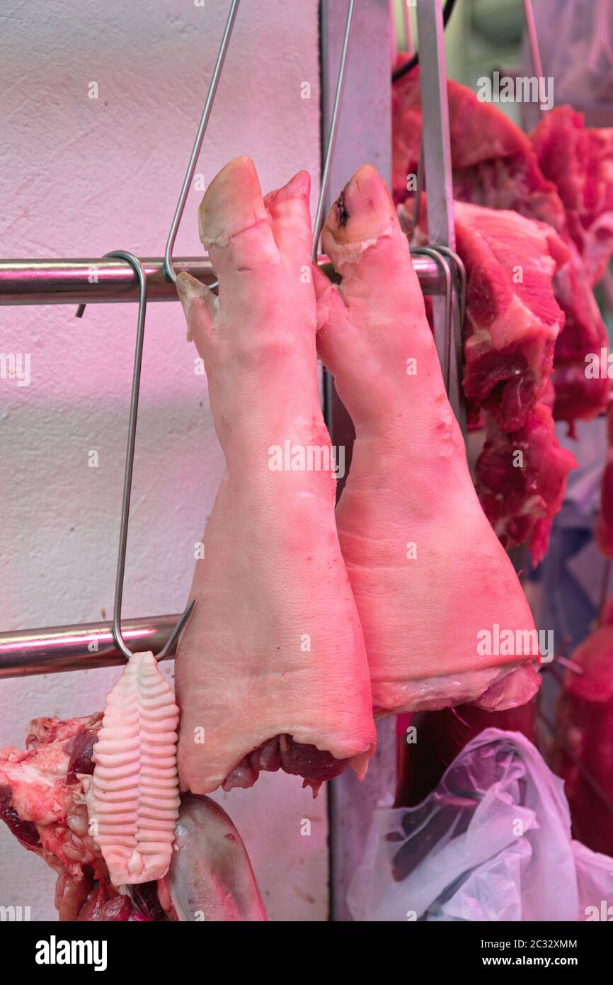 Pigs Feet Trotters Hanging in Butcher Shop Stock Photo - Alamy