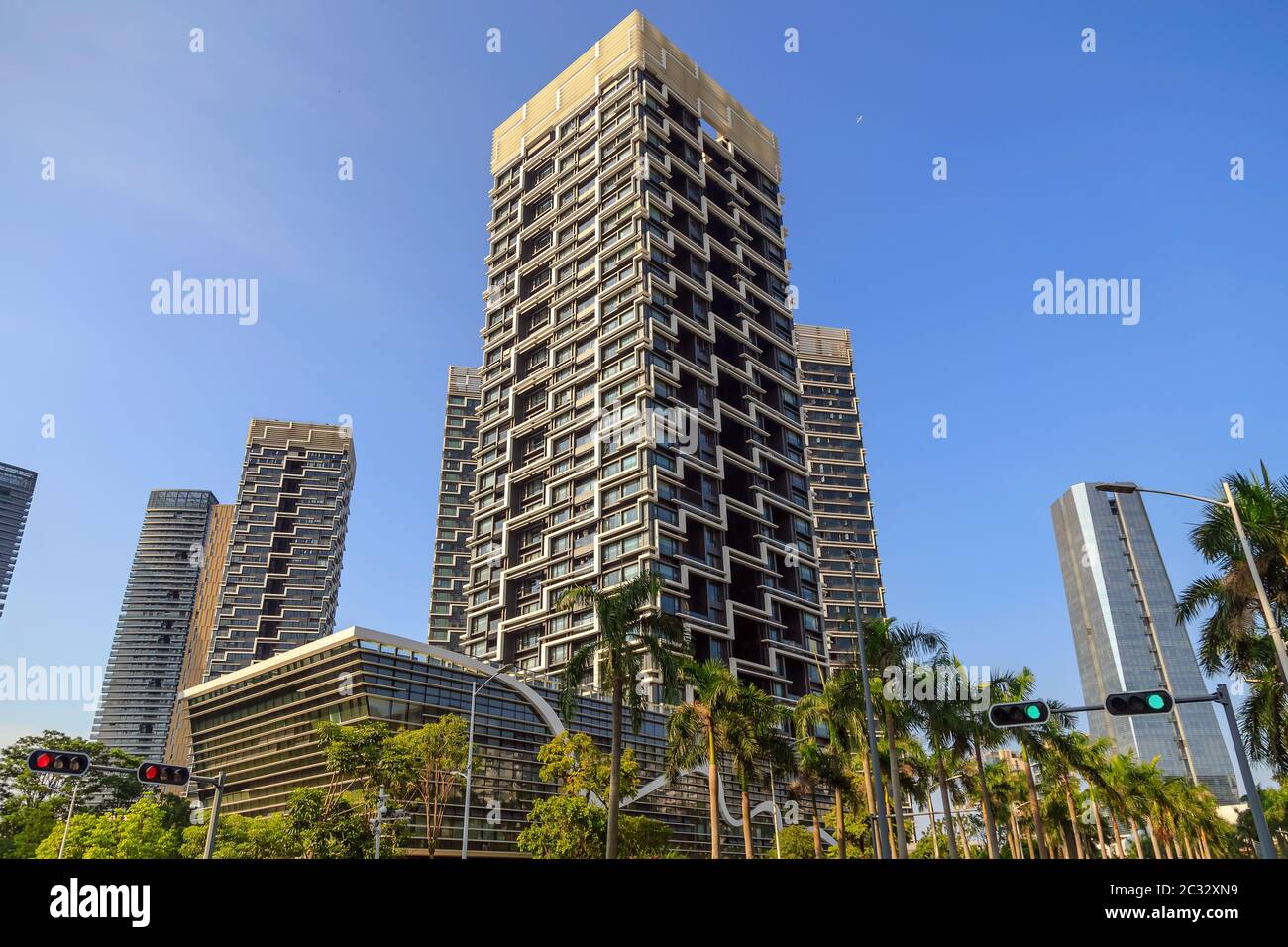 High-rise buildings in the city in clear sunny weather with tropical ...