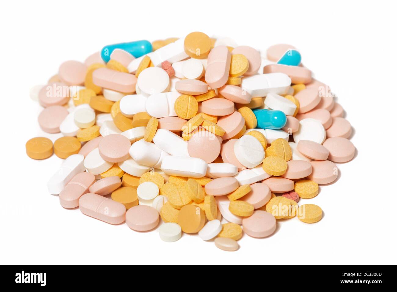 Assorted mix of pills over a white background Stock Photo - Alamy
