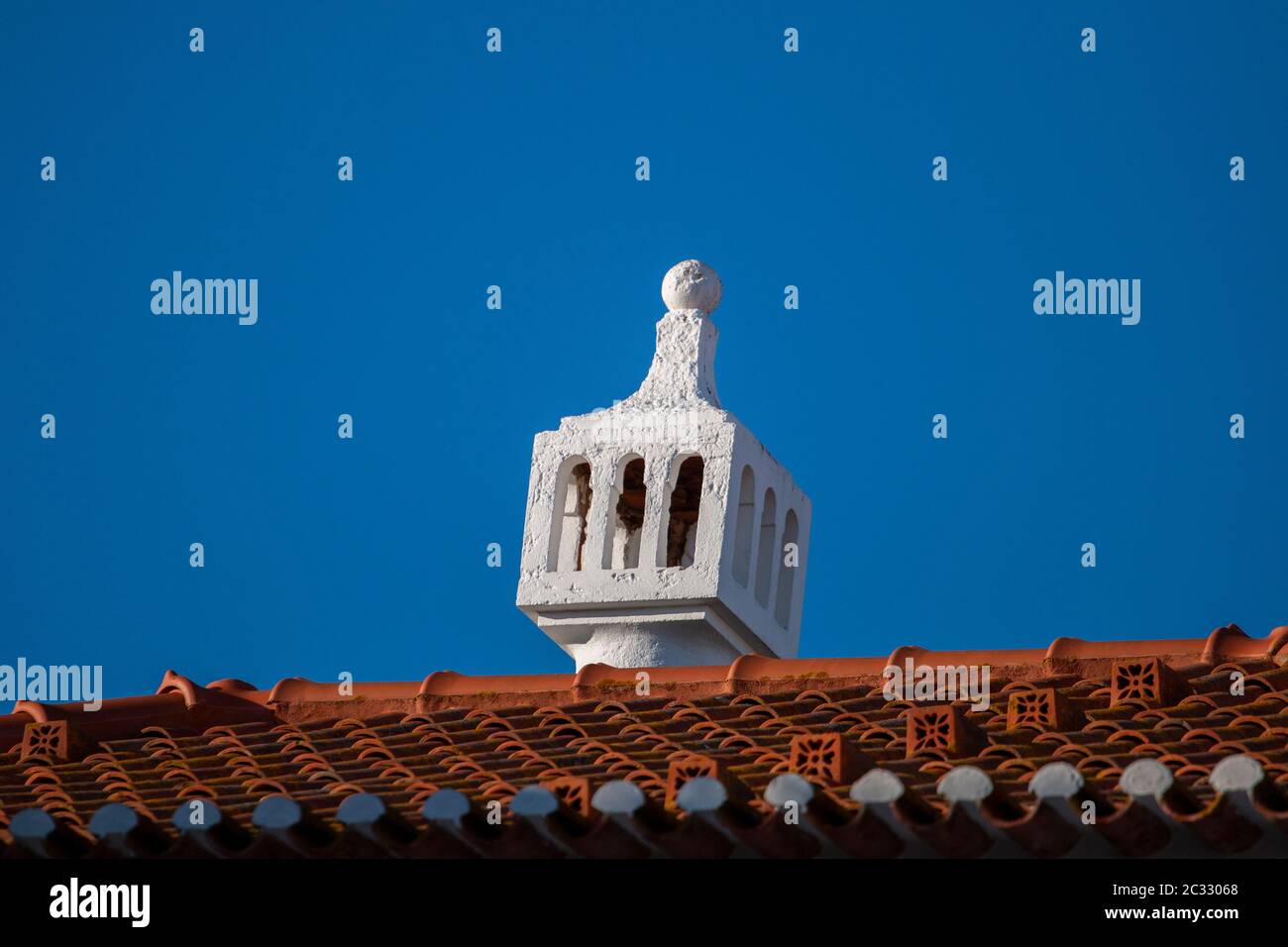 Close view of the white traditional and beautiful portuguese chimneys ...