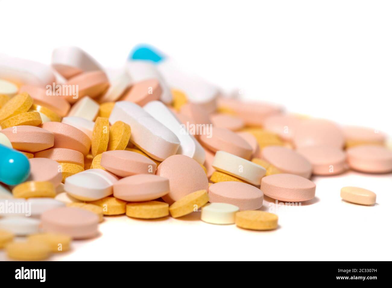 Assorted mix of pills over a white background Stock Photo - Alamy