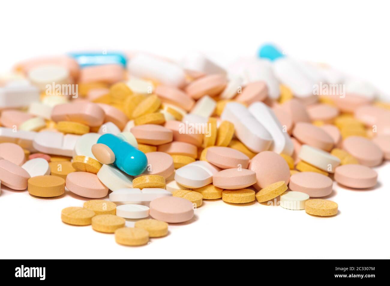 Assorted mix of pills over a white background Stock Photo - Alamy
