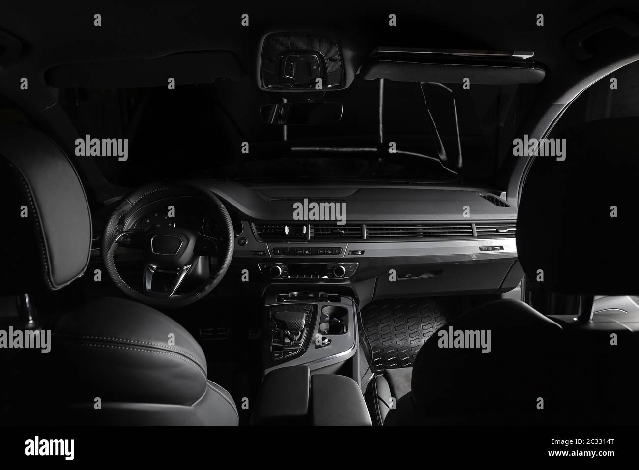 Interior of luxury suv car with black leather steering wheel and shift ...