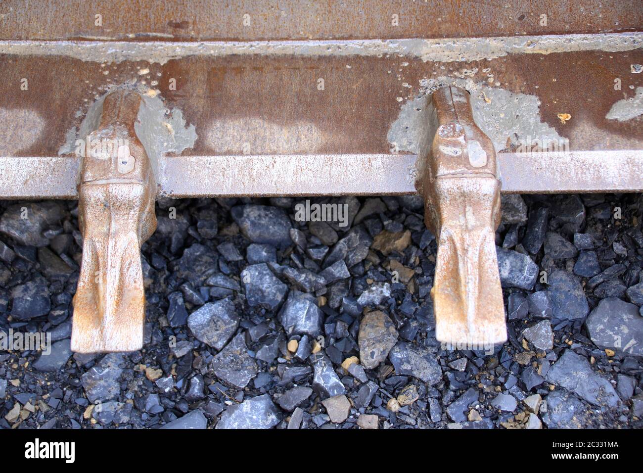 Teeth on a bucket on a wheel loader Stock Photo - Alamy
