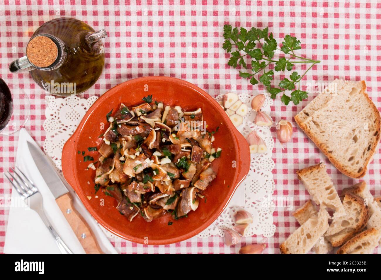 roasted pig ear with garlic and olive oil Stock Photo - Alamy