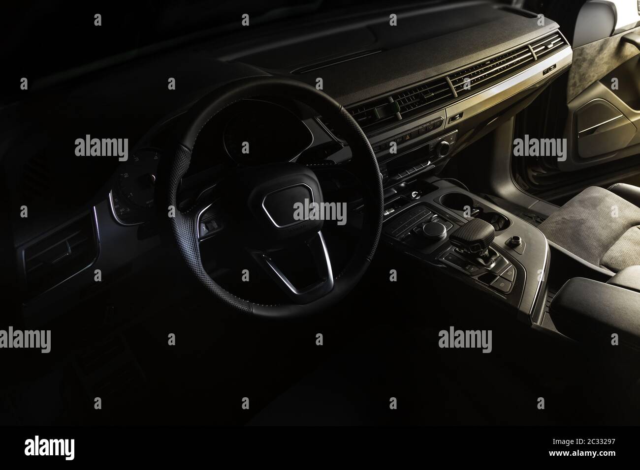 Interior of luxury suv car with black leather steering wheel and shift ...