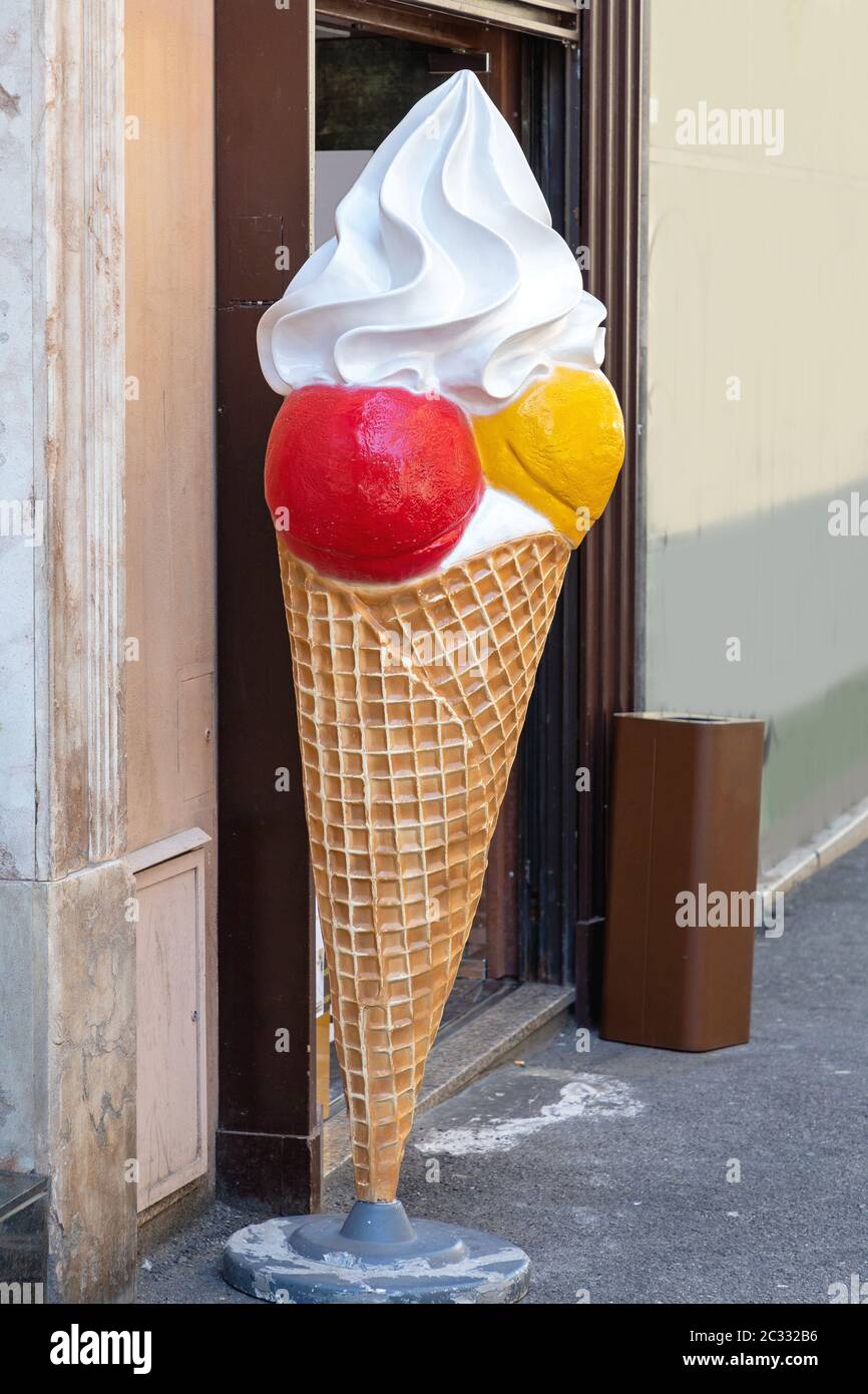 Big Ice Cream Cone Sign at Street Stock Photo - Alamy