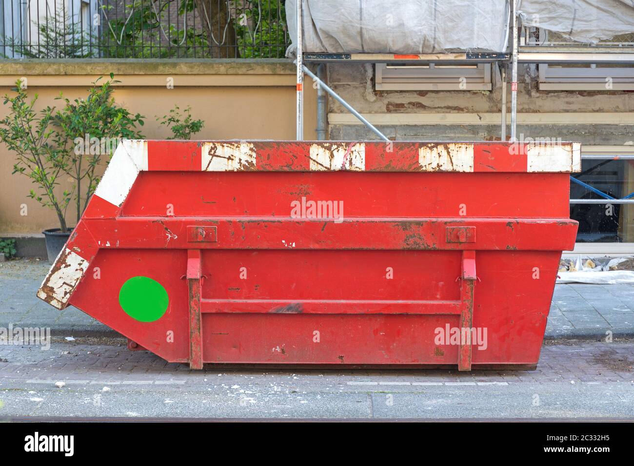Big Red Skip Container at Construction Site in City Stock Photo - Alamy